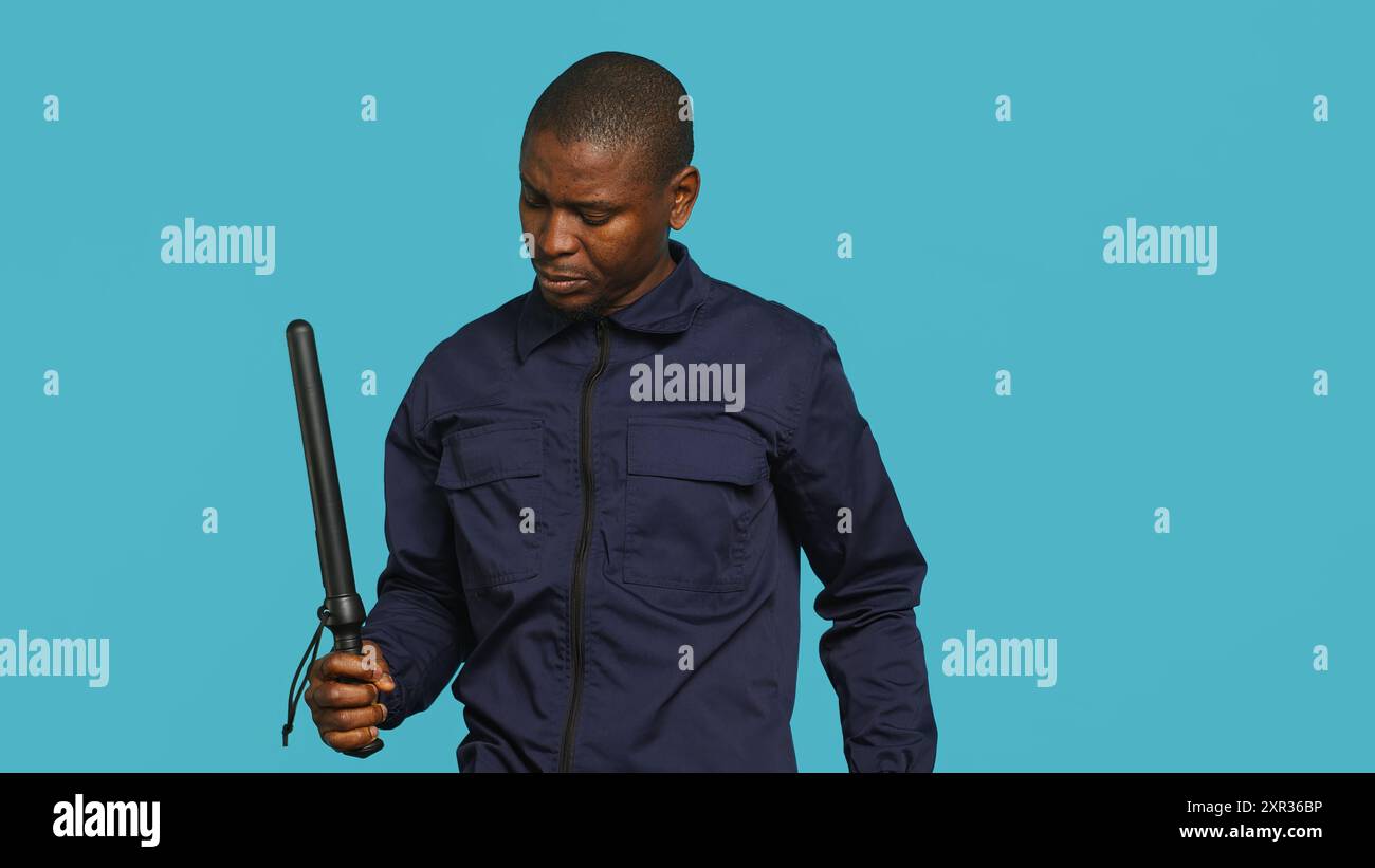 Security guard tasked with restricting unwanted access looking to sky ...