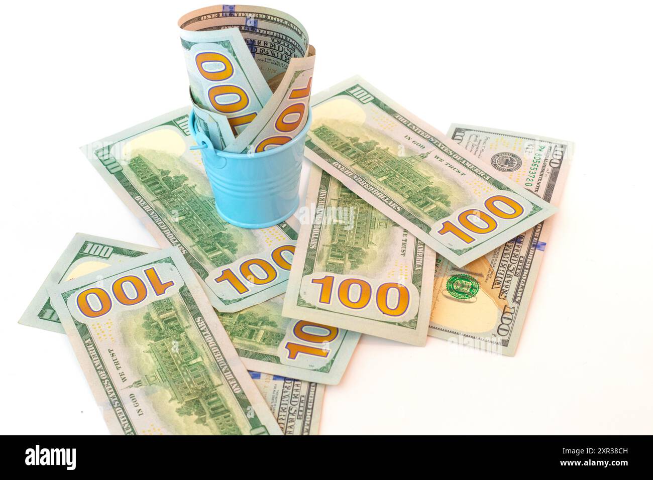 small bucket with dollar bills on a white background. Bucket full of ...