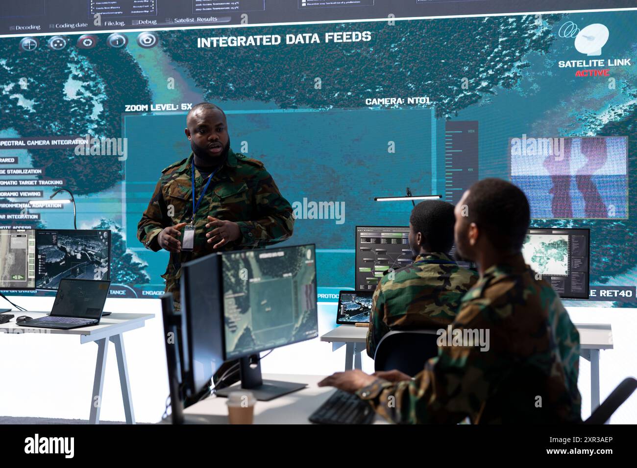 Military personnel operate advanced systems in a command center, focusing on surveillance and ...
