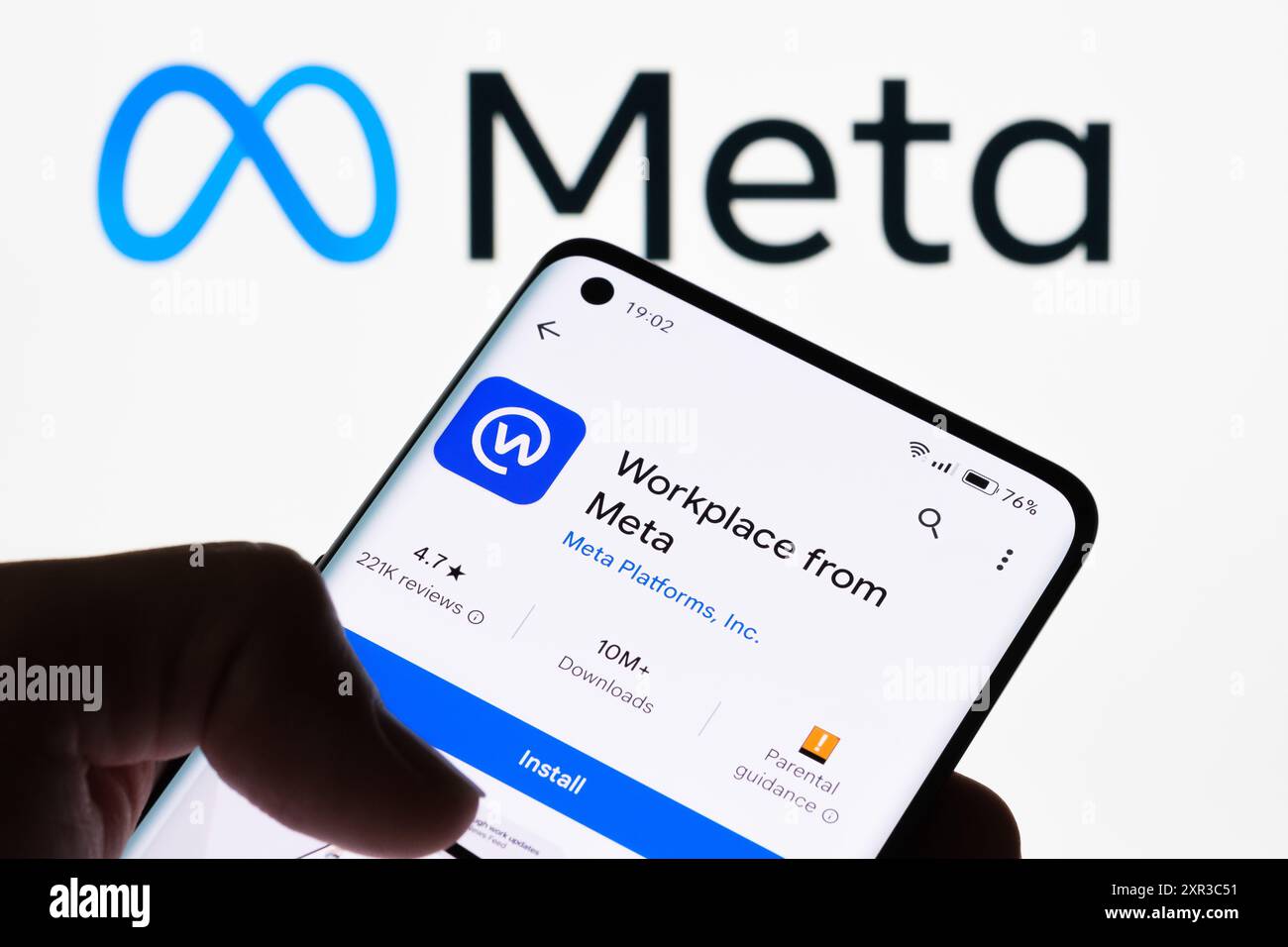Close-up of a smartphone screen displaying Workplace from Meta app with ...