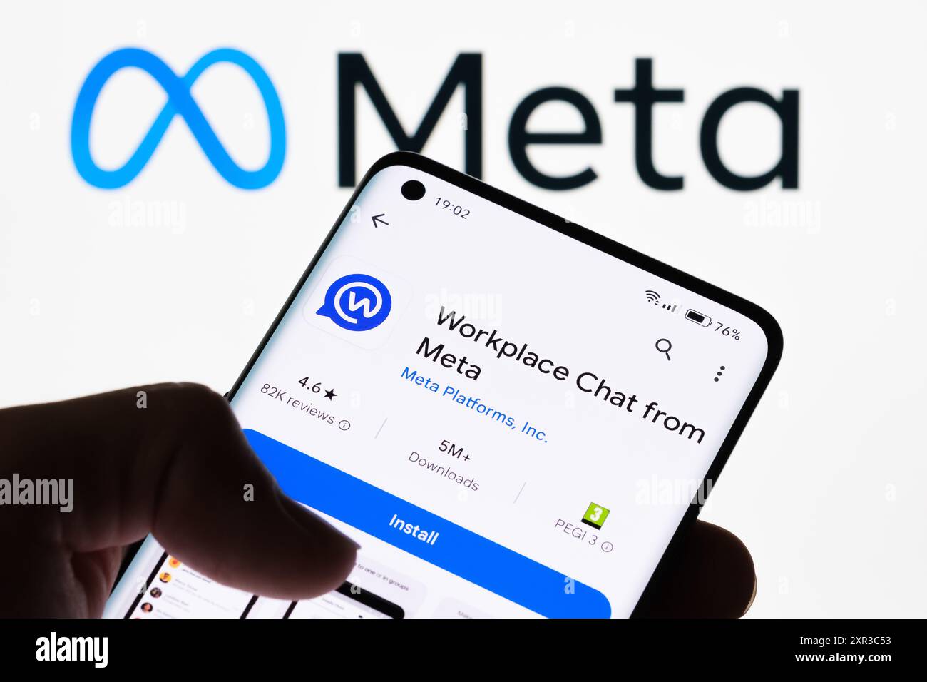 Close-up of a smartphone screen displaying Workplace Chat from Meta app ...