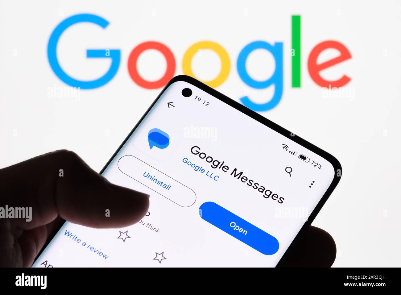 Close-up of a smartphone screen displaying Google Messages app with ...