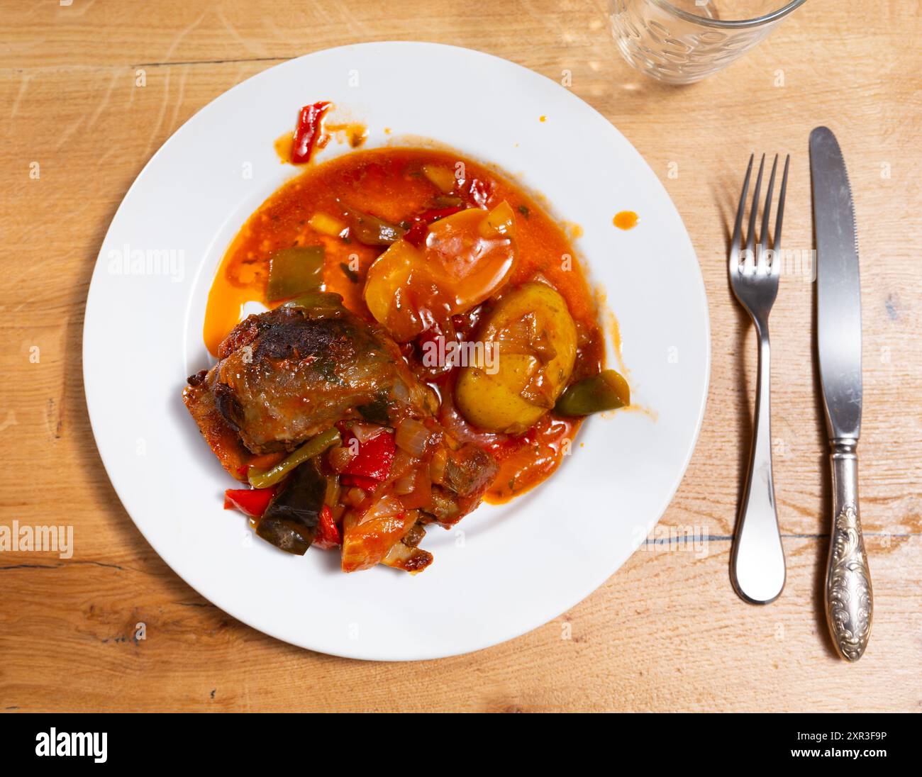 Baked pork cheek served with vegetables Stock Photo - Alamy