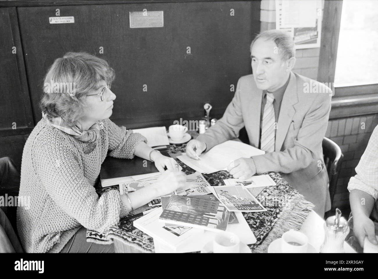 Man and woman look at booklets about communism from the 1950s, 00-05 ...