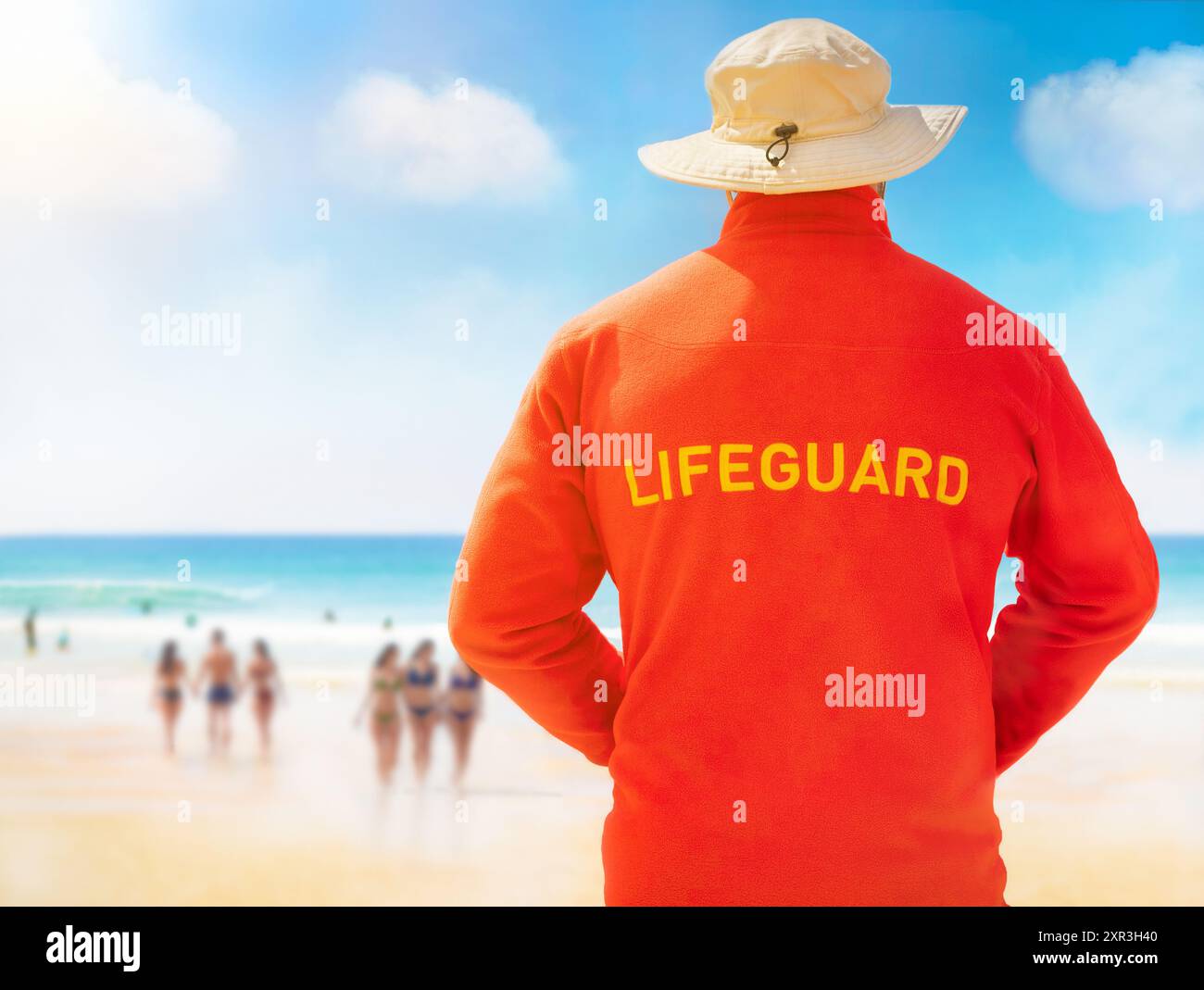 Coastal scene of lifeguard who is a professional rescuer supervising ...
