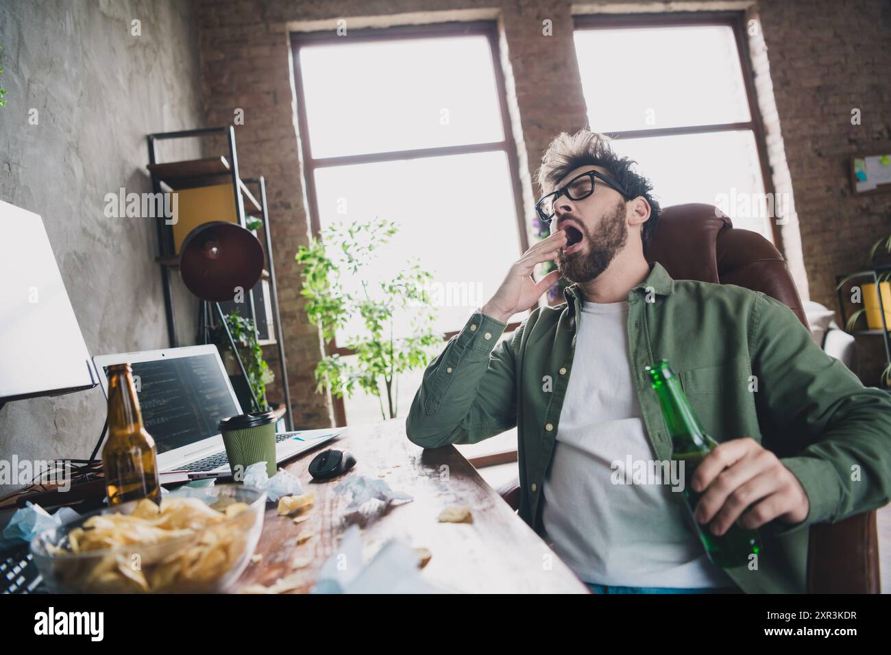 Photo of professional it specialist young man beer chips computer ...