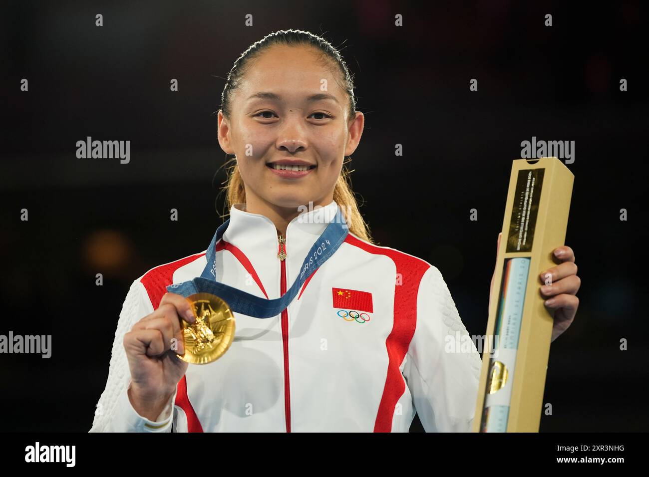 China's Chang Yuan celebrates gold during a medal ceremony for the ...