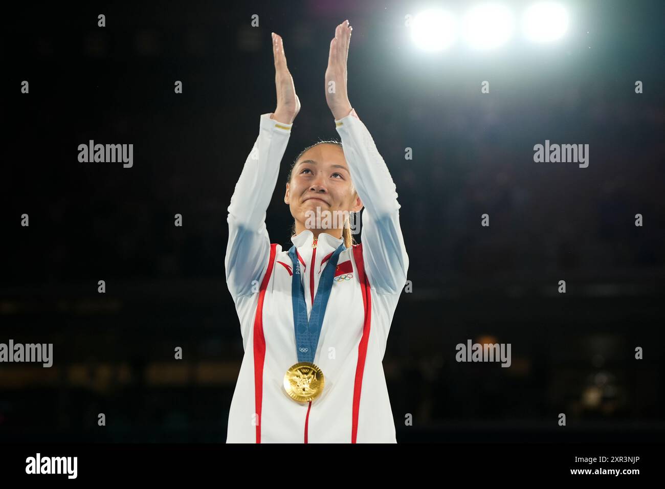 China's Chang Yuan celebrates gold during a medal ceremony for the ...