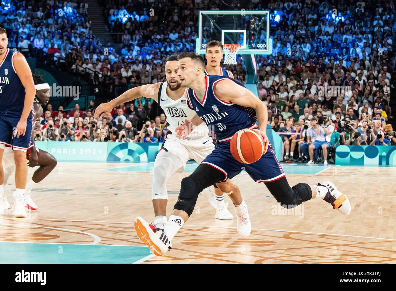 Aleksa Avramovic ( 30 - Serbia) and Stephen Curry ( 4 - USA ...
