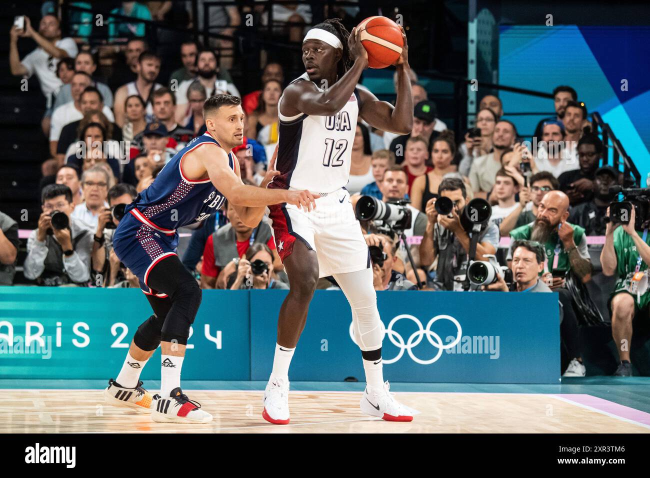 Jrue Holiday ( 12 - USA) and Aleksa Avramovic ( 30 - Serbia ...