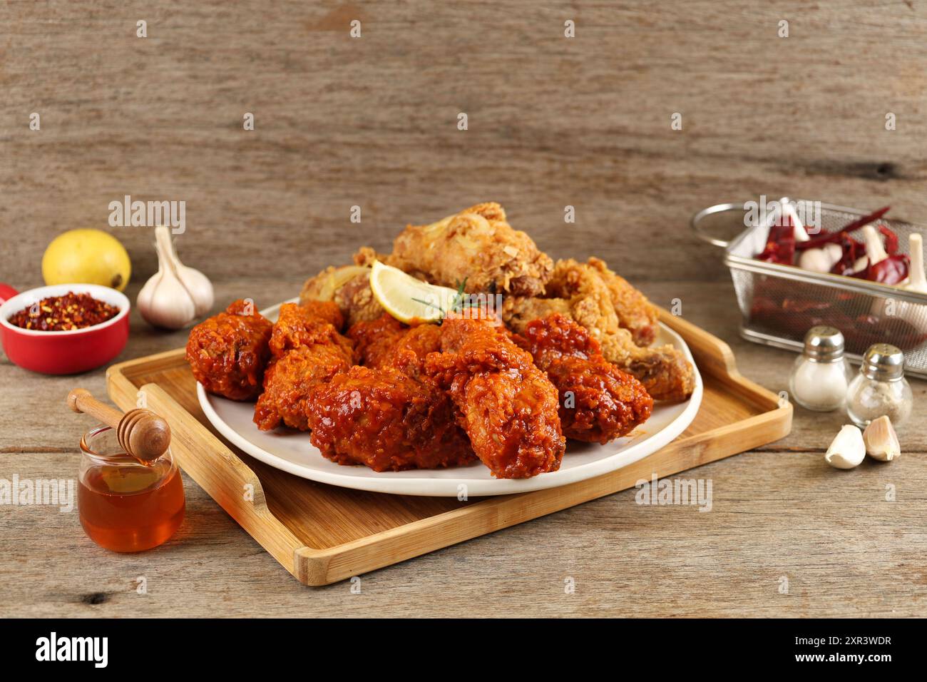 Spicy and Honey Crispy Fried Chicken. Concept Half and Half Or Ban Ban ...