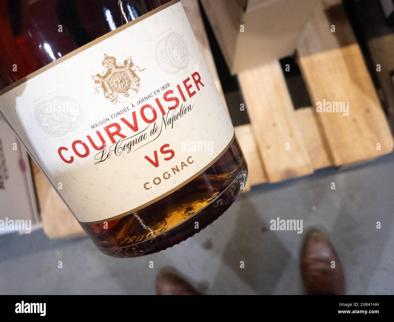 Picture of a sign with the logo of courvoisier on their bottle for sale ...