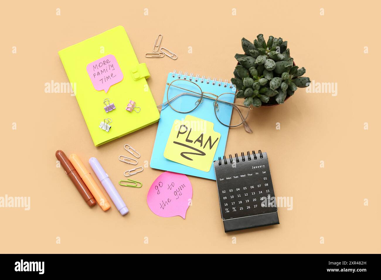 Notebook with to do plans, sticky notes and calendar on beige ...