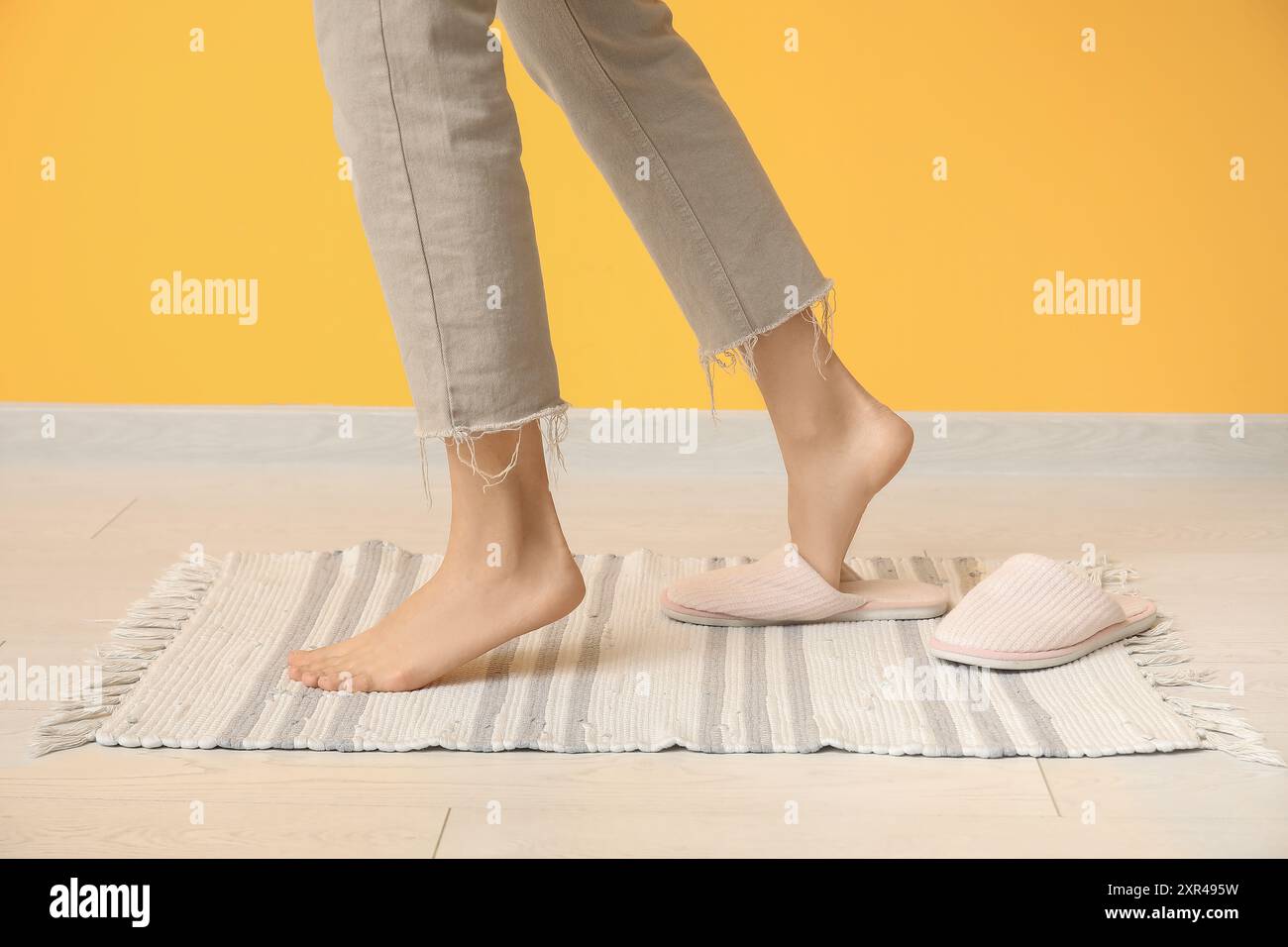 Woman taking off fluffy slippers hi-res stock photography and images ...