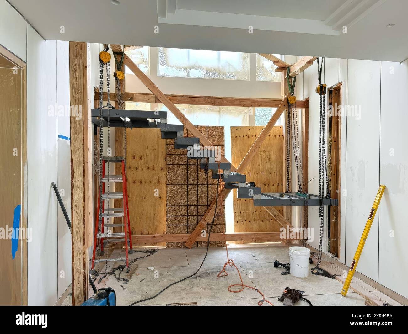 Metal support stairs to second floor are being installed in new ...
