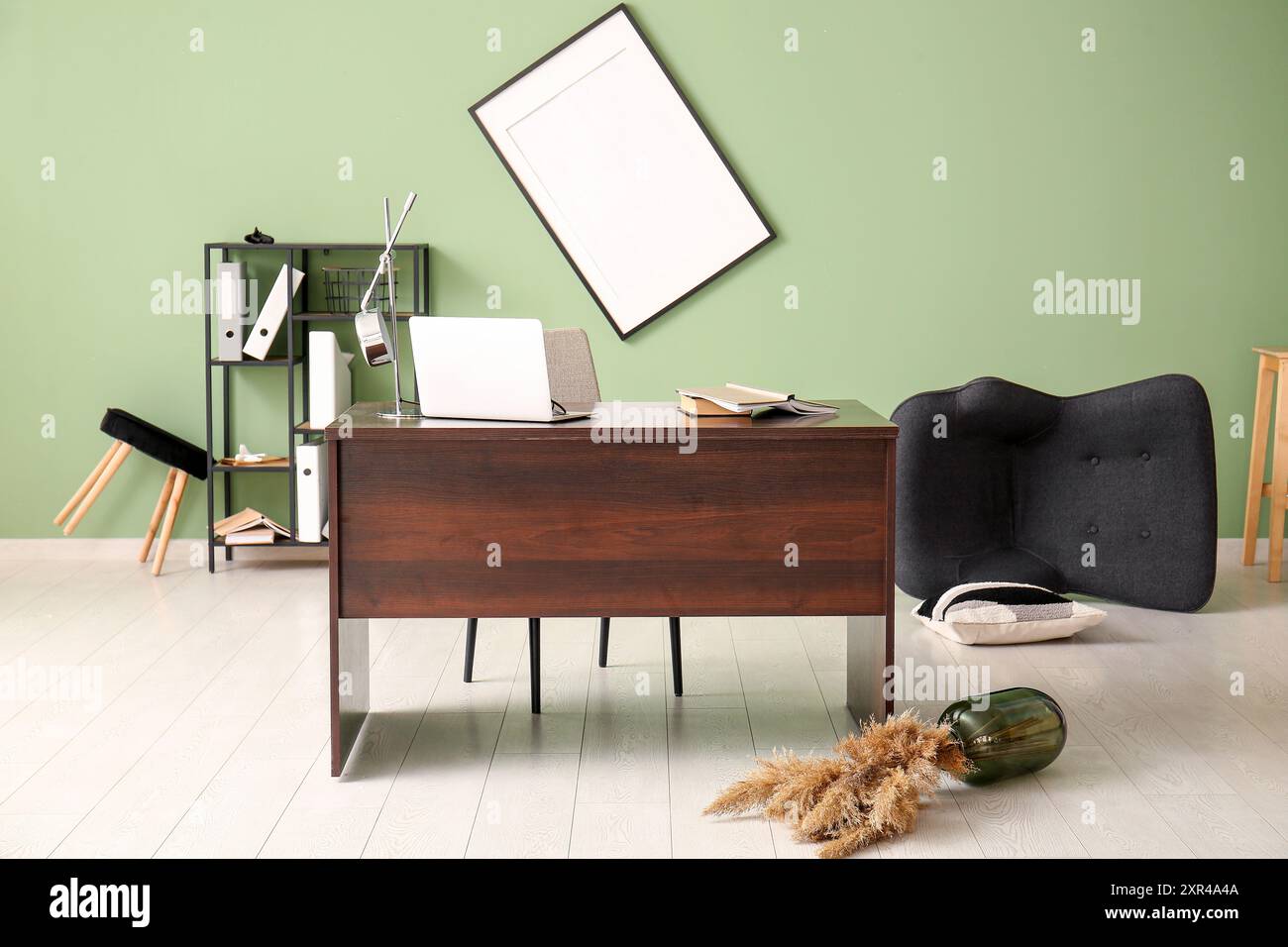 Interior of damaged office with armchair and workplace after earthquake ...