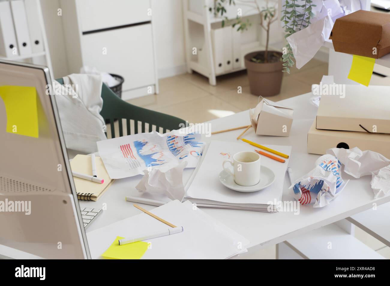 Messy workplace with coffee cup and crumpled paper in office Stock ...