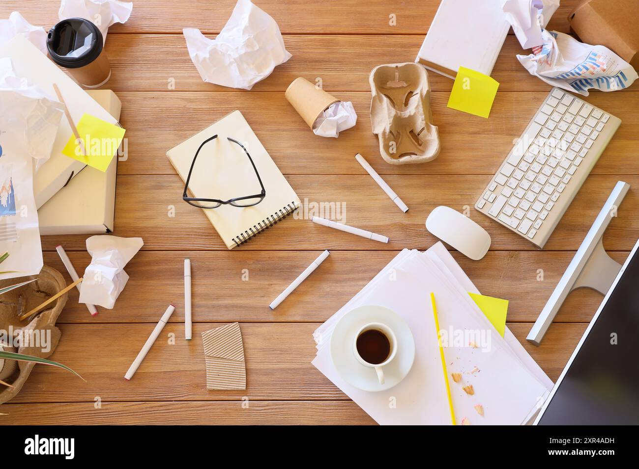Messy workplace with stationery and garbage in office, top view Stock ...
