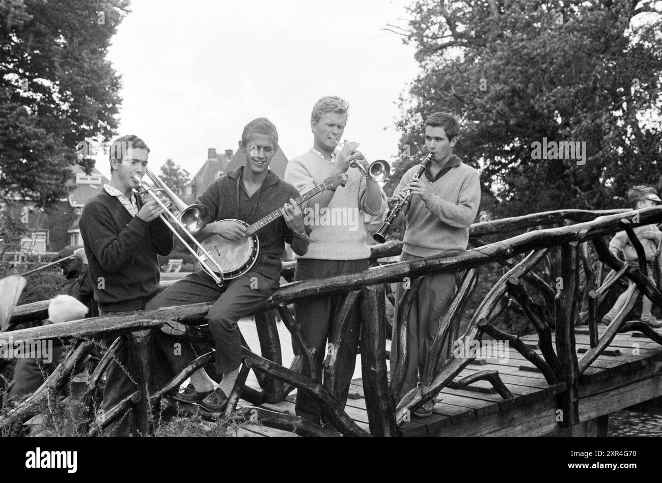 Music group with three wind instruments and someone with a banjo on a ...