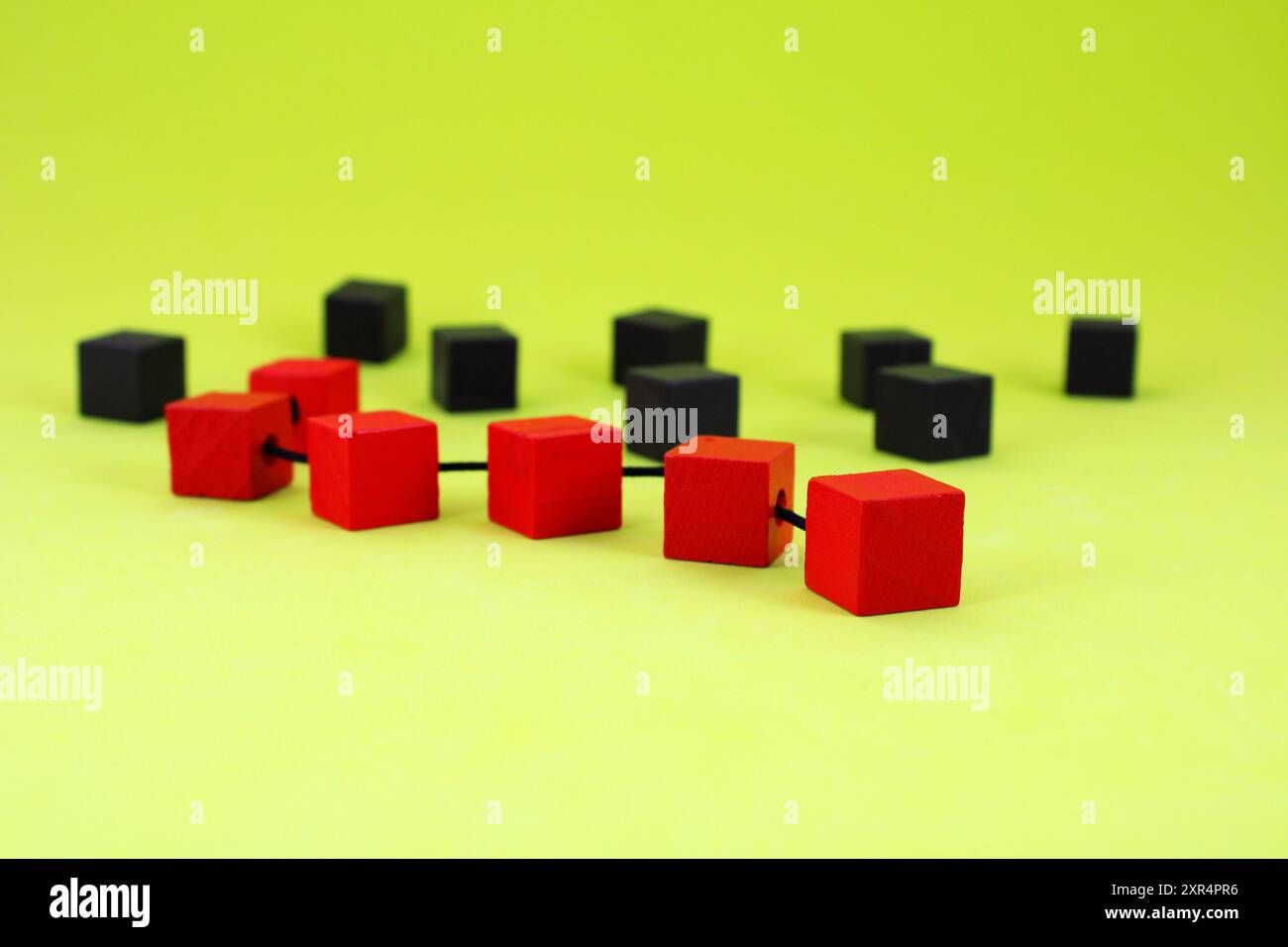 Wooden cubes that are separated into two groups Stock Photo - Alamy