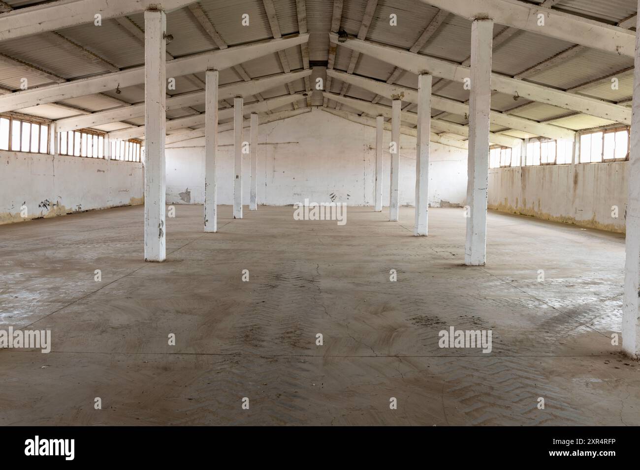Interior of an empty abandoned warehouse Stock Photo - Alamy