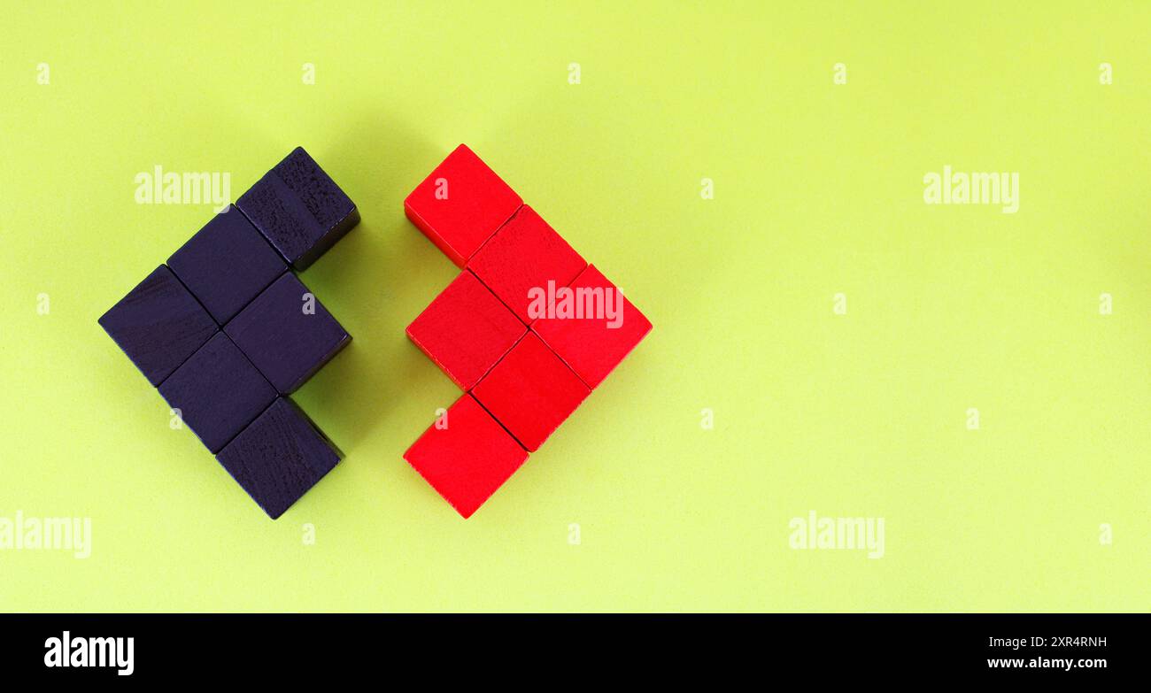 Arrows pointing in opposite directions formed with wooden cubes Stock ...