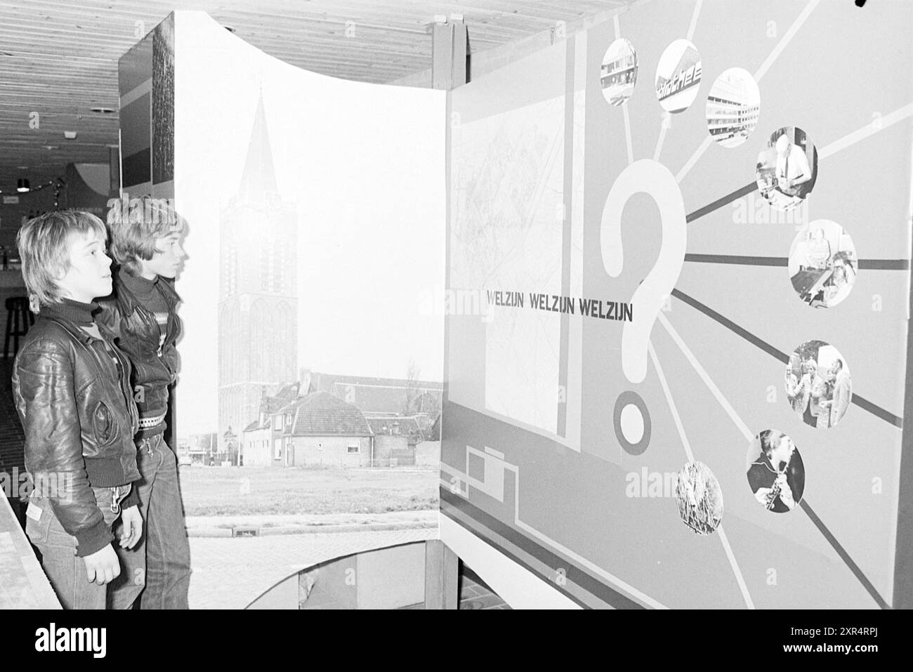 Boys look at poster about the usefulness of welfare work, 00-00-1977 ...