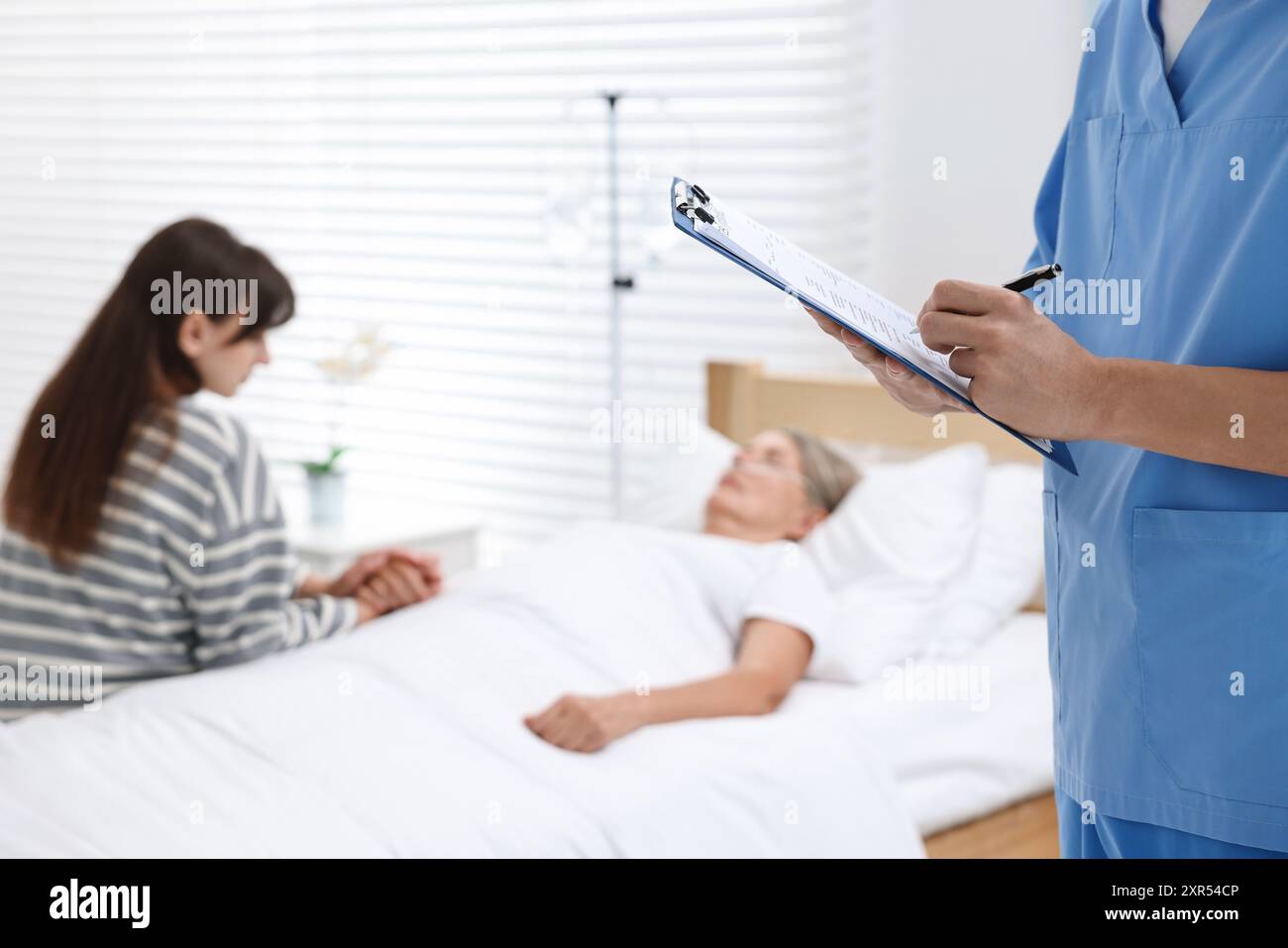 Coma patient. Doctor near unconscious mature woman in hospital, closeup ...