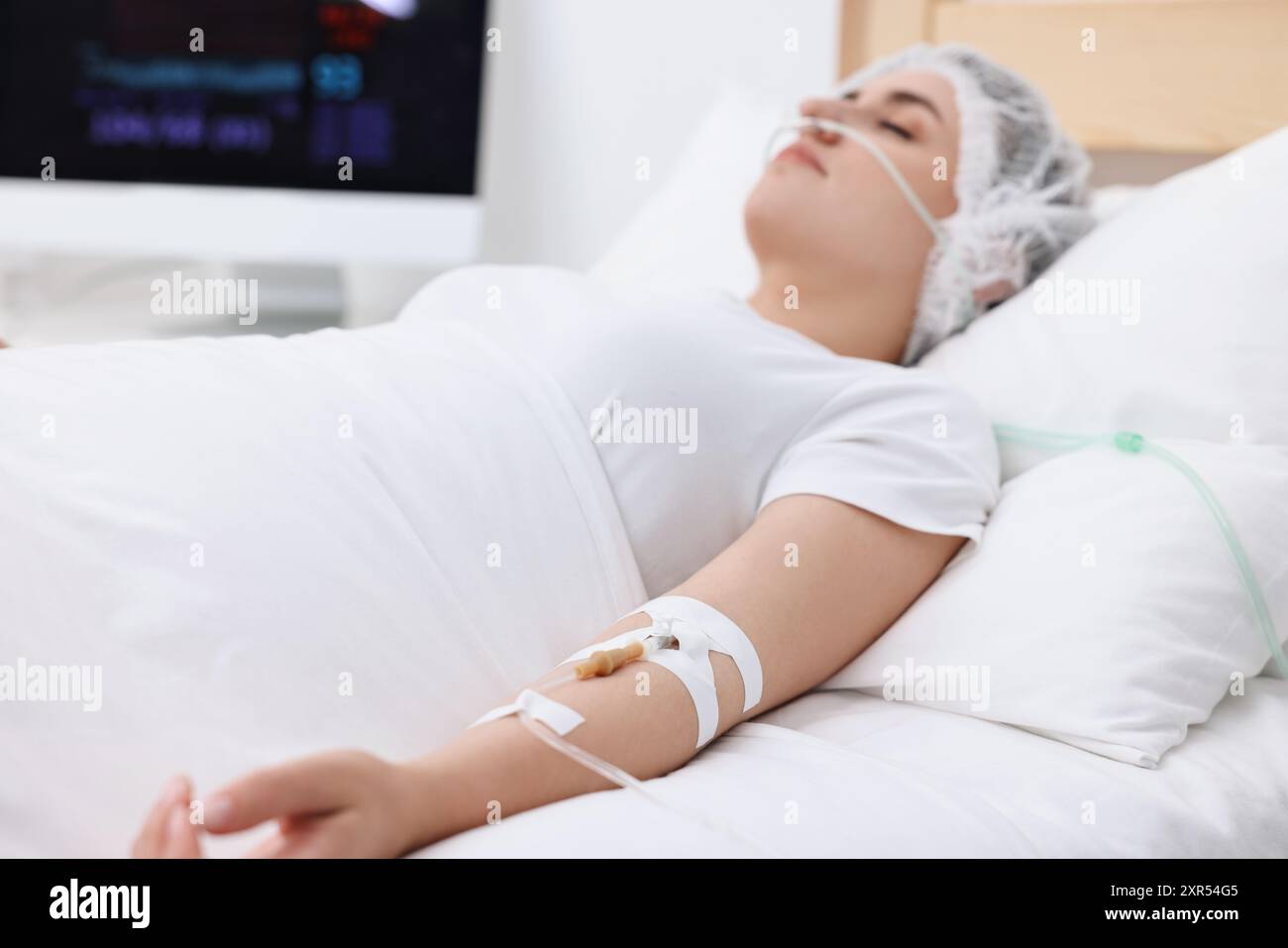 Coma patient. Woman with intravenous drip in hospital bed, selective focus Stock Photo - Alamy