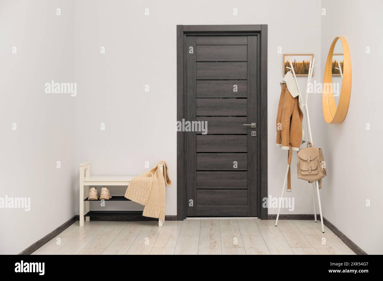 Coat rack, mirror and shoe storage bench in hallway. Interior design ...