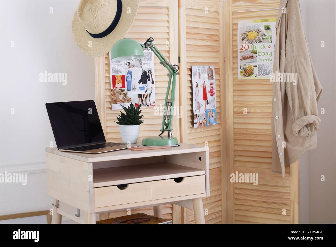 Folding screen, table, laptop and lamp indoors. Interior design Stock ...
