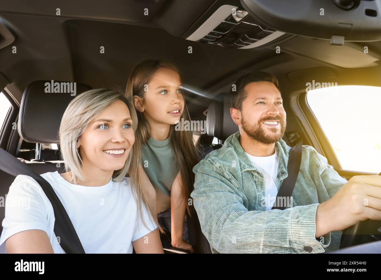 Happy family on road trip. Parents with daughter in car Stock Photo - Alamy