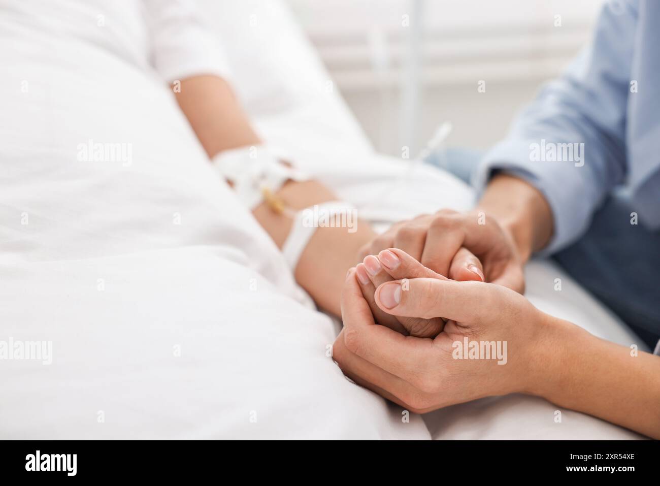 Coma patient. Man near unconscious woman in hospital, closeup Stock ...