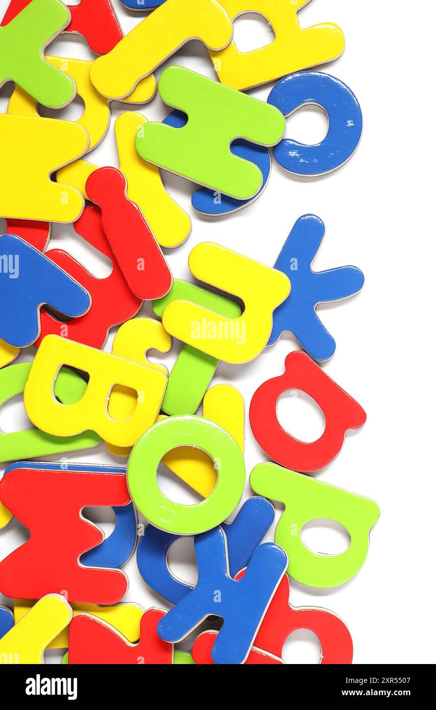 Alphabet. Many colorful magnetic letters isolated on white, top view ...