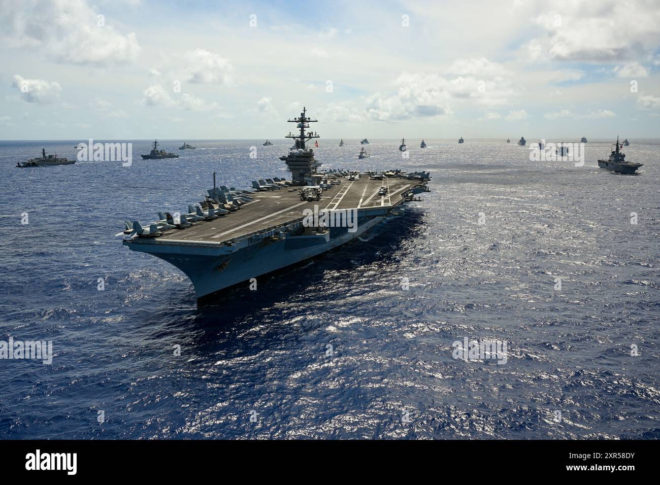 The Nimitz-class aircraft carrier USS Carl Vinson (CVN 70) leads a ...