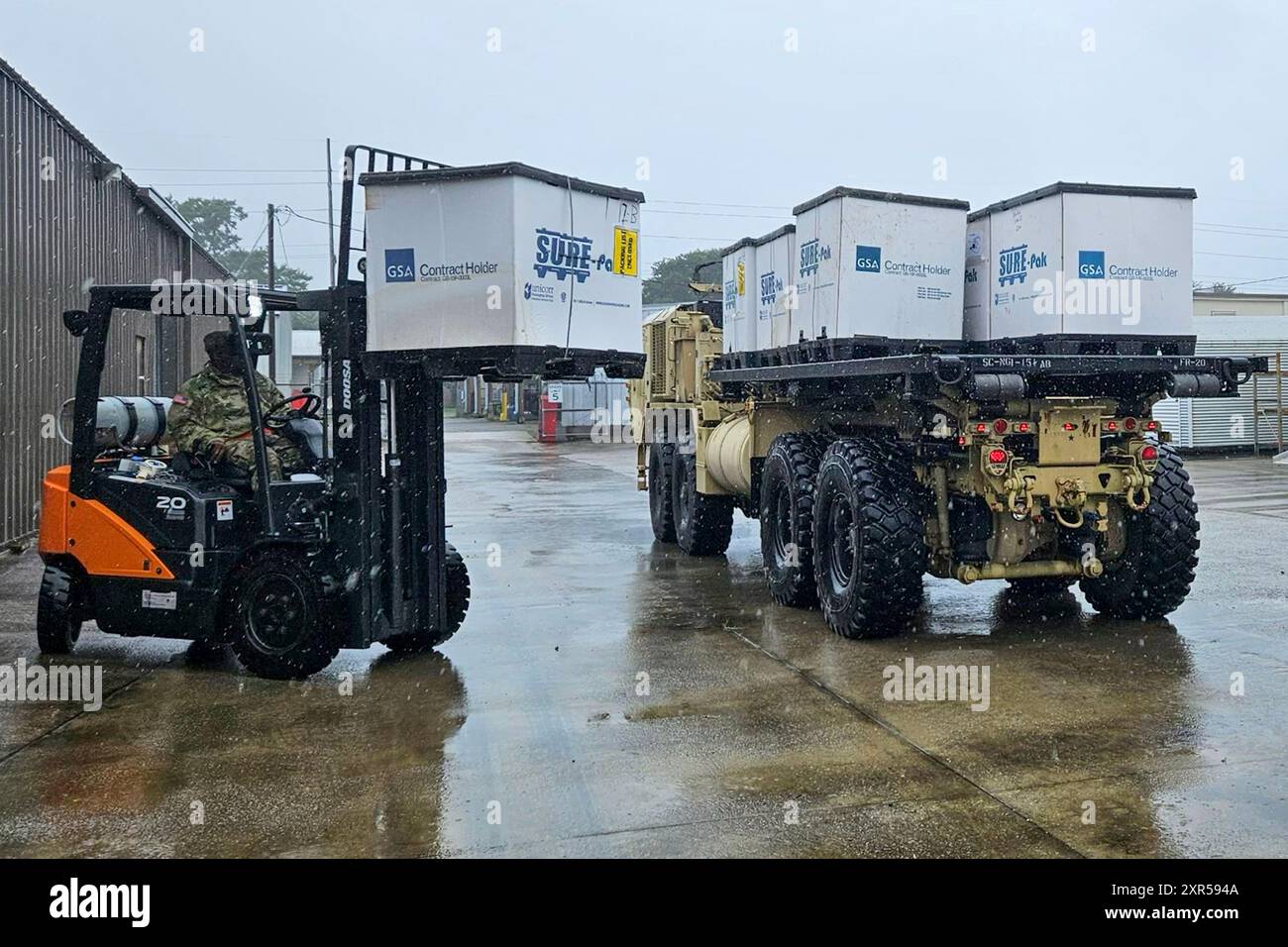 Members of the 751st CSSC Task Force load personal protective equipment ...