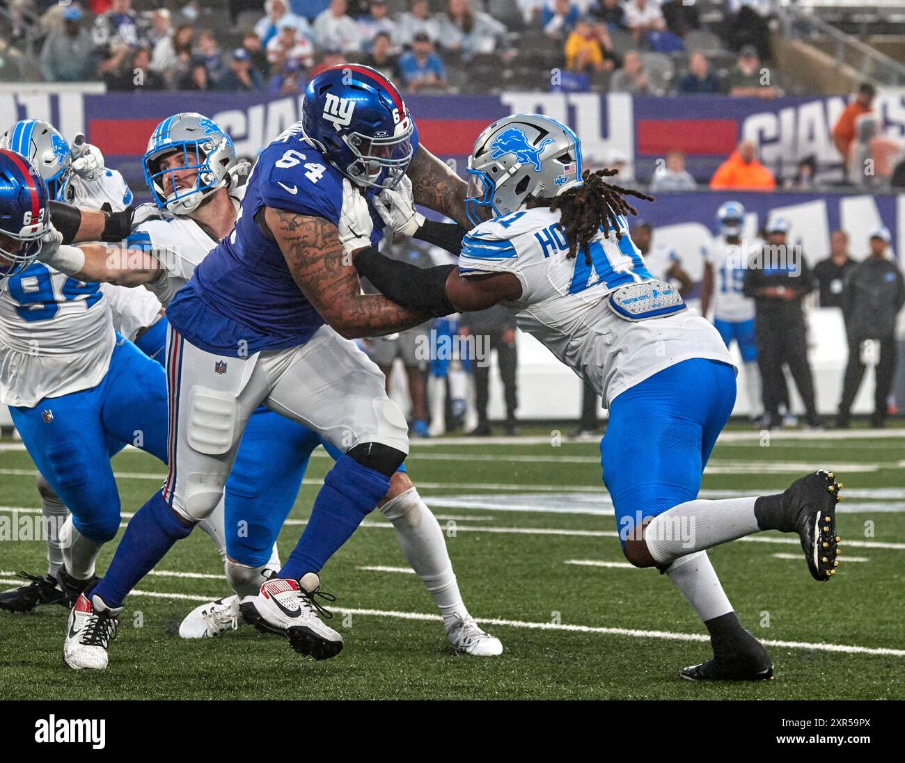 New York Giants guard Aaron Stinnie (64) blocks Detroit Lions ...