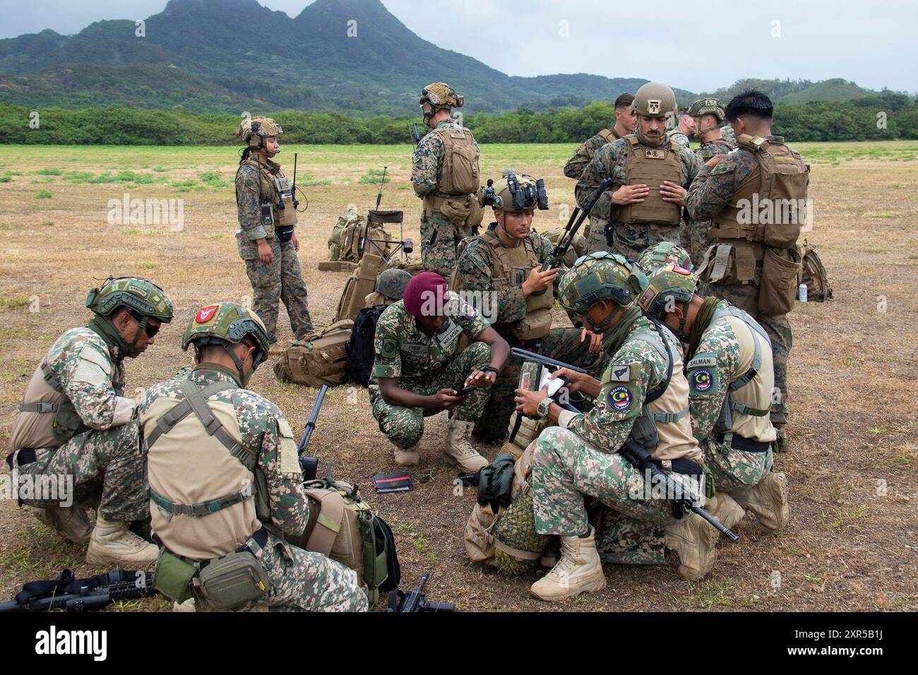 Service members from the Malaysian Armed Forces and U.S. Marines gather ...