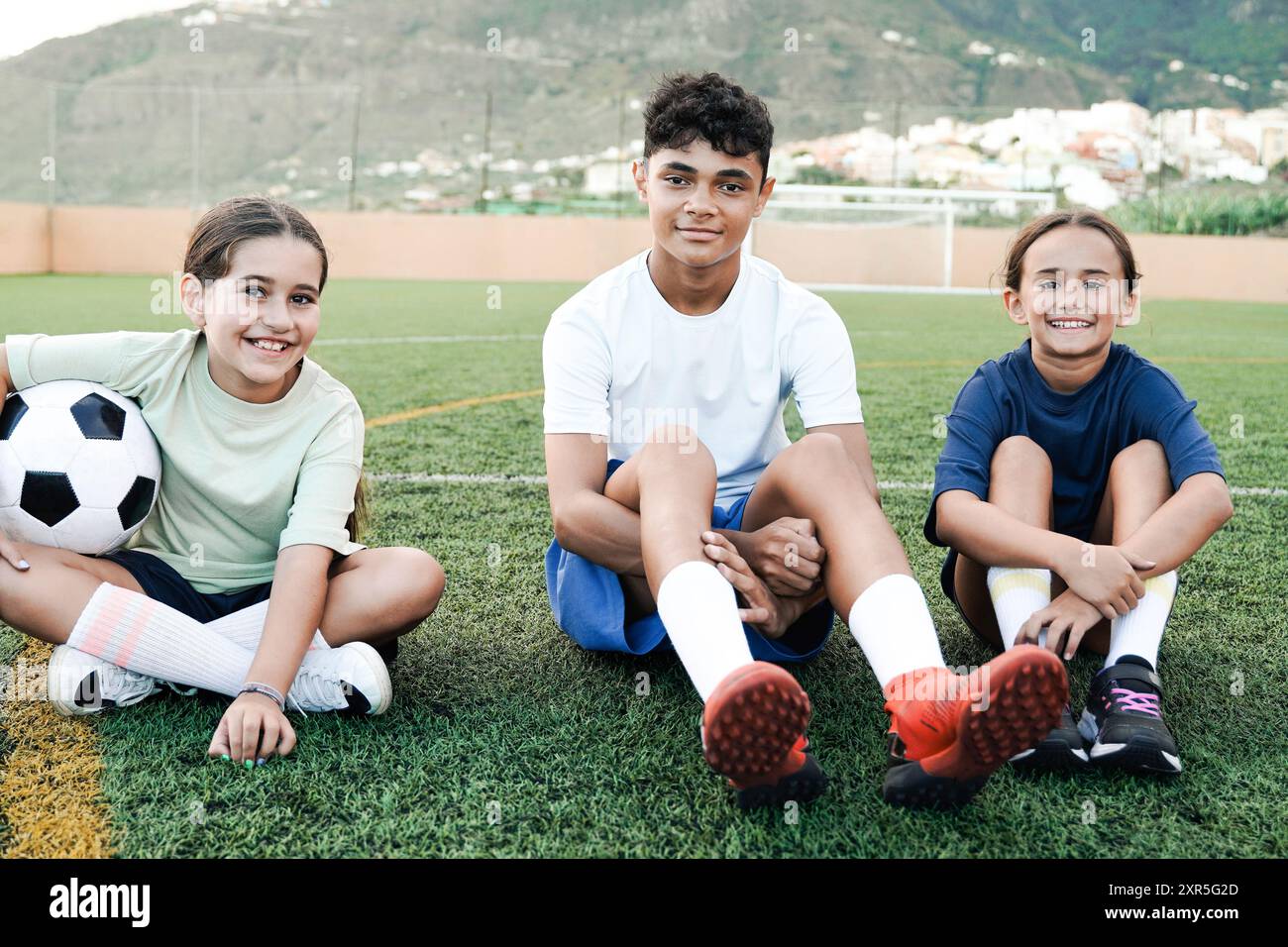 Soccer, Children having fun after football training at school stadium ...