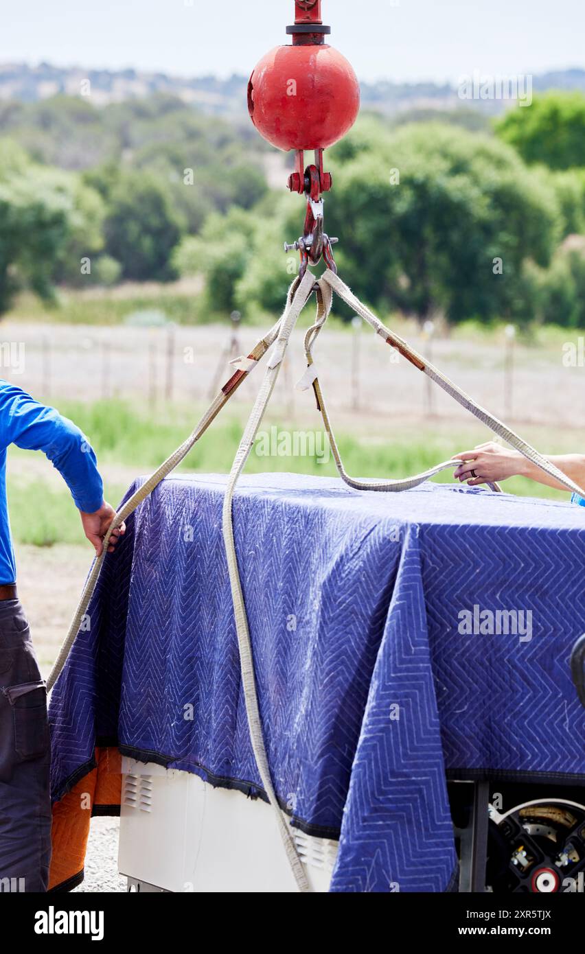 Hooking up Generator to crane truck lift for installation Stock Photo ...