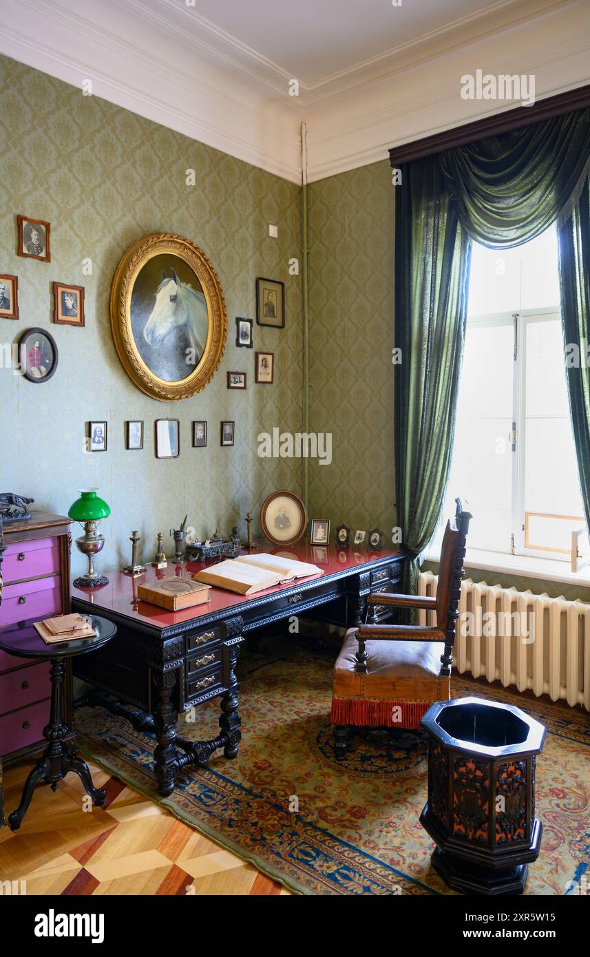 KARABIKHA, RUSSIA - AUGUST 22, 2023: A desk with old books, photographs ...