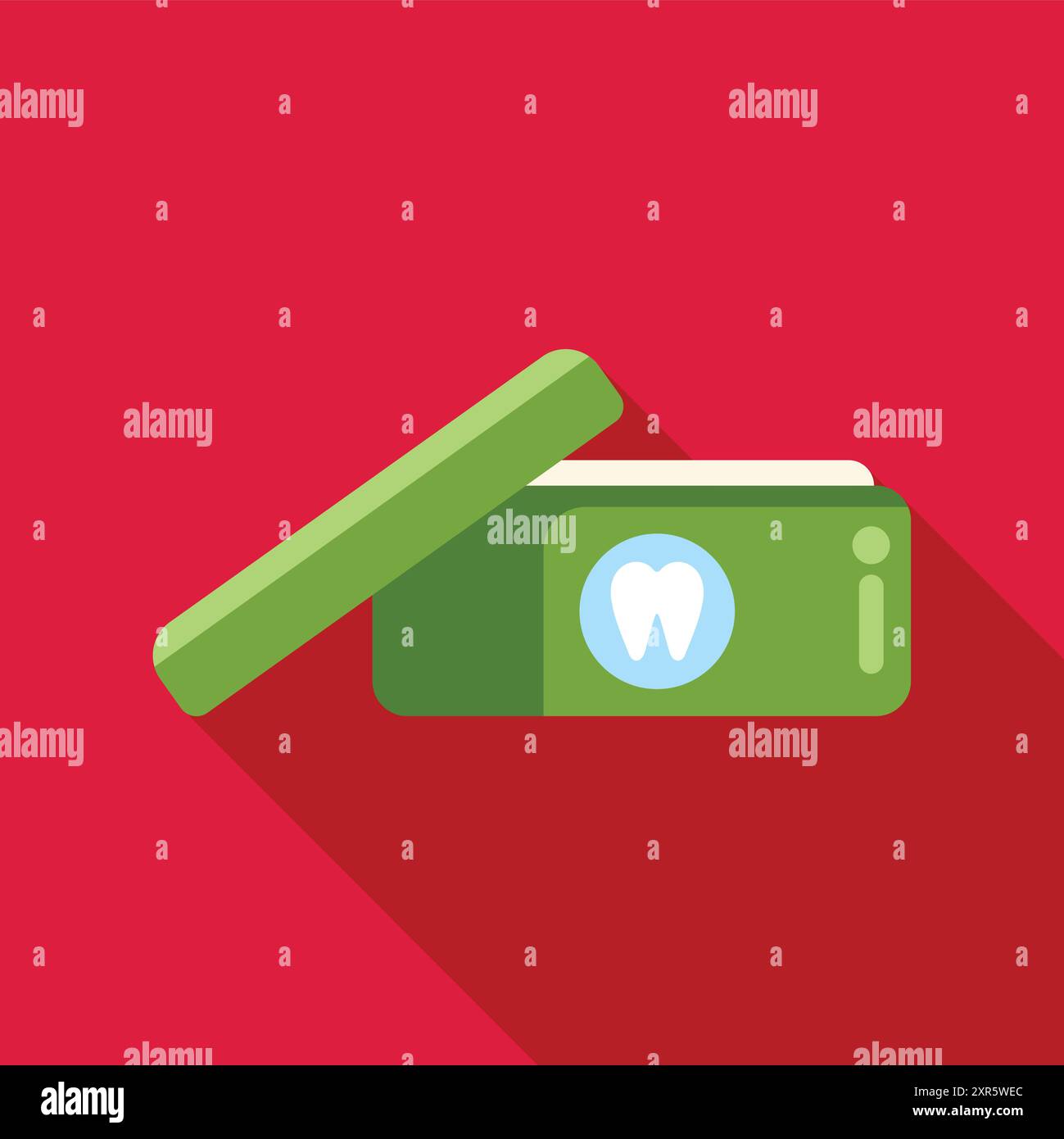 Green dental floss box with its lid open, lying on a red background ...