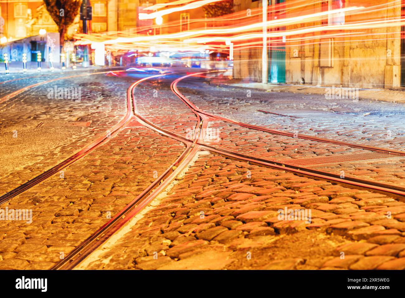 Urban texture of tram rails with city lights in Lisbon, Portugal Stock ...