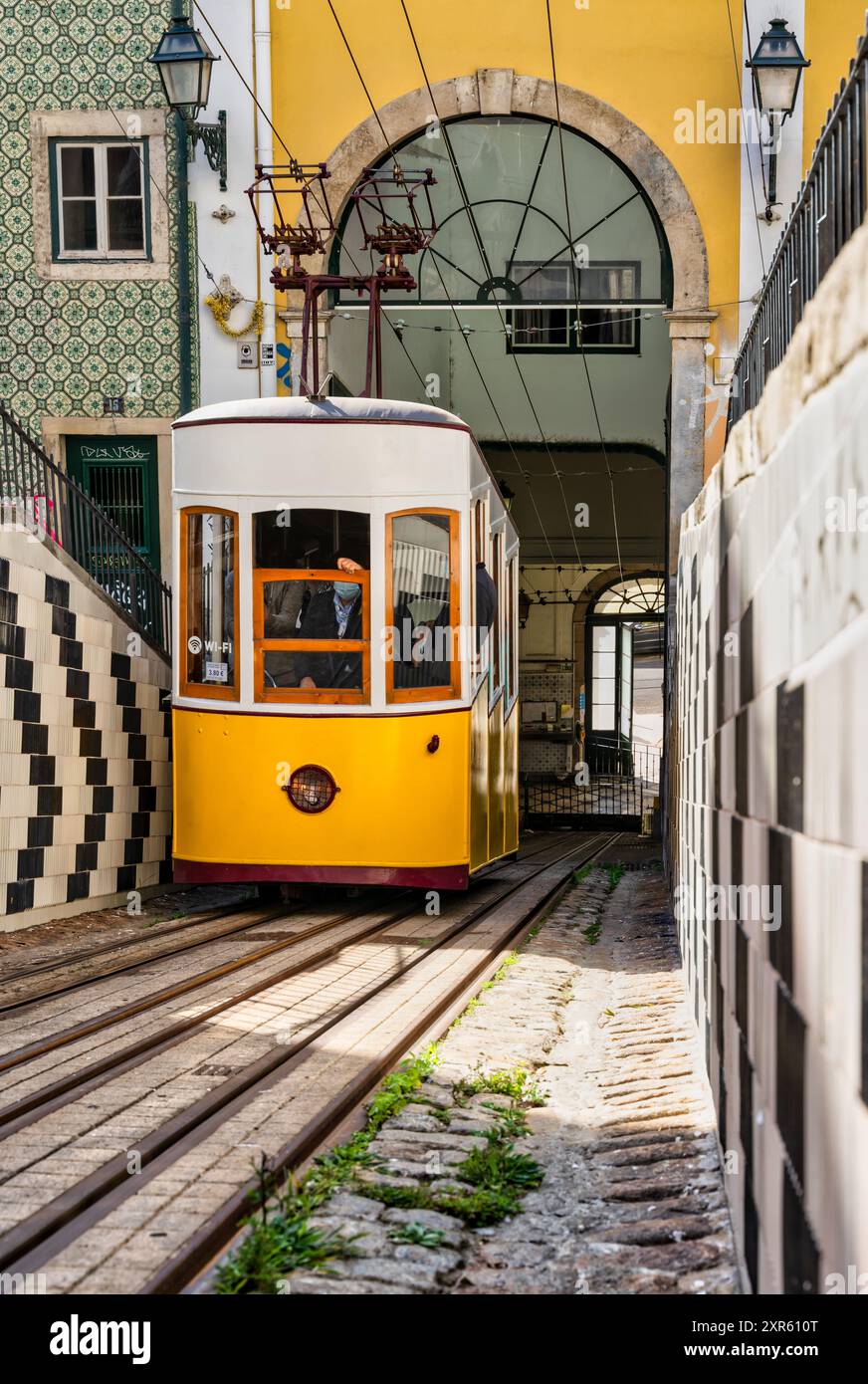 Yellow elevator going up the slope of one of the typical neighborhoods ...