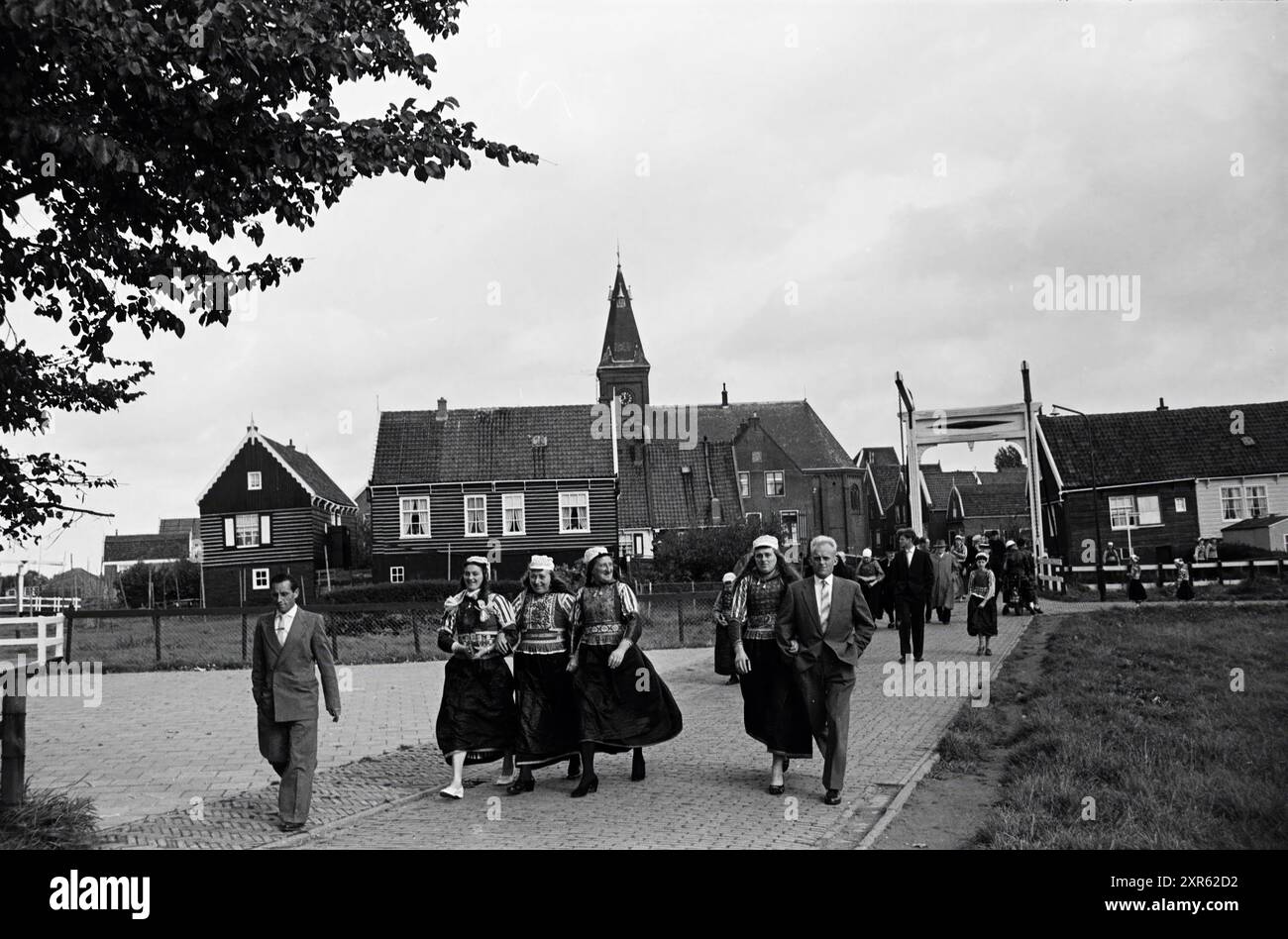 People on Marken in traditional costumes with the reformed church in ...