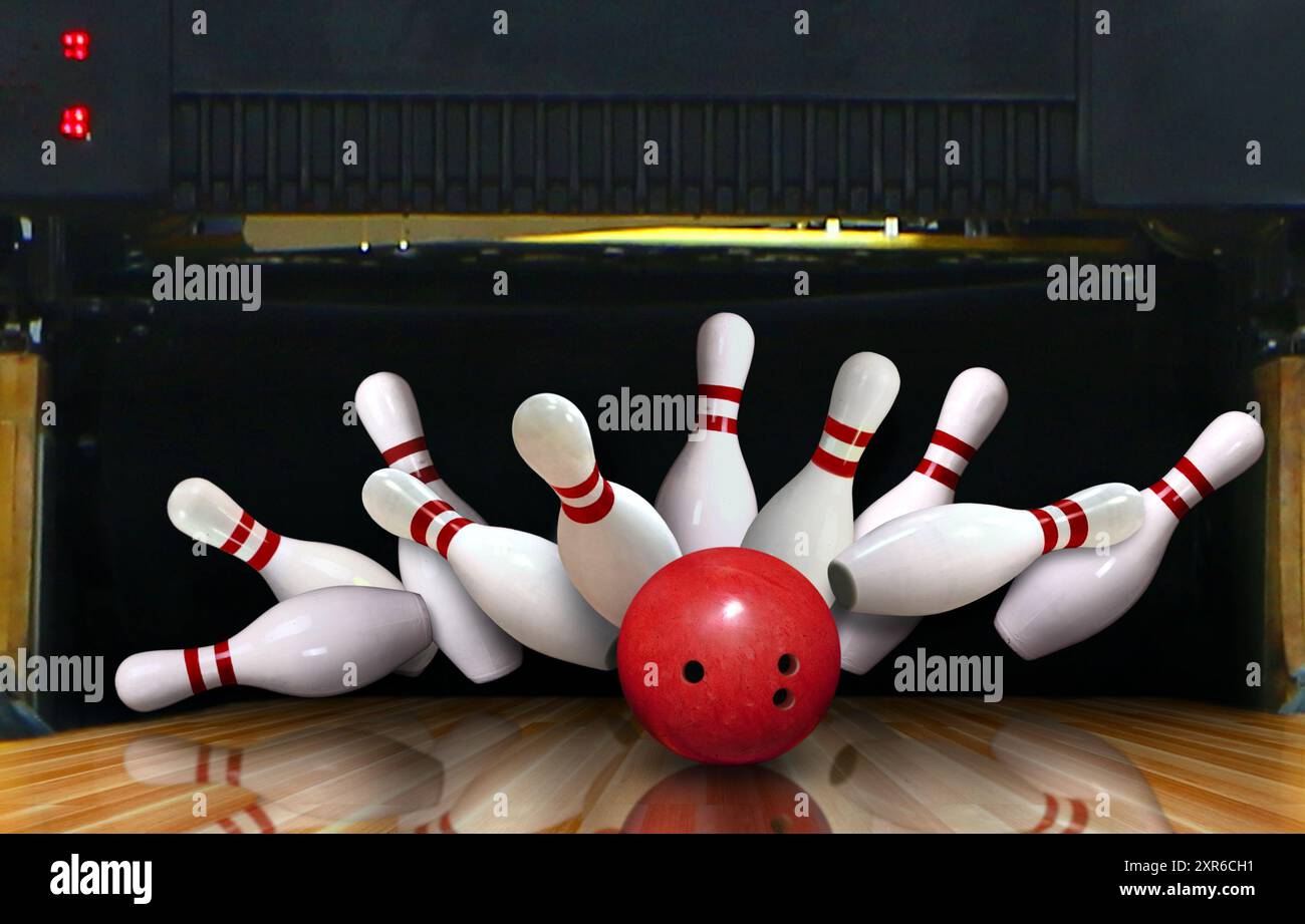 Bowling strike hit with ball hitting ten pins in the alley Stock Photo ...