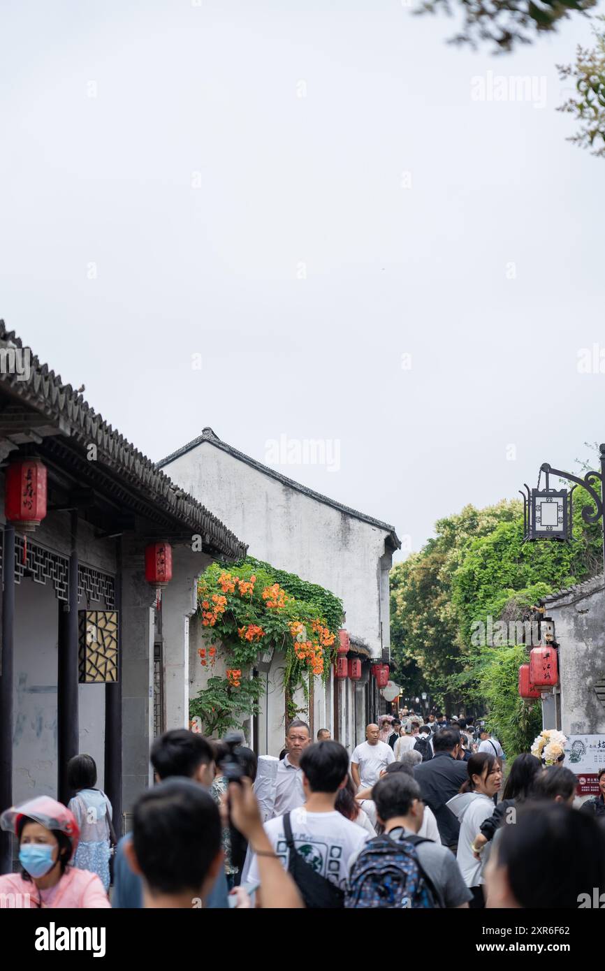 Suzhou, China - June 11, 2024 : A crowded street in a Chinese city with ...