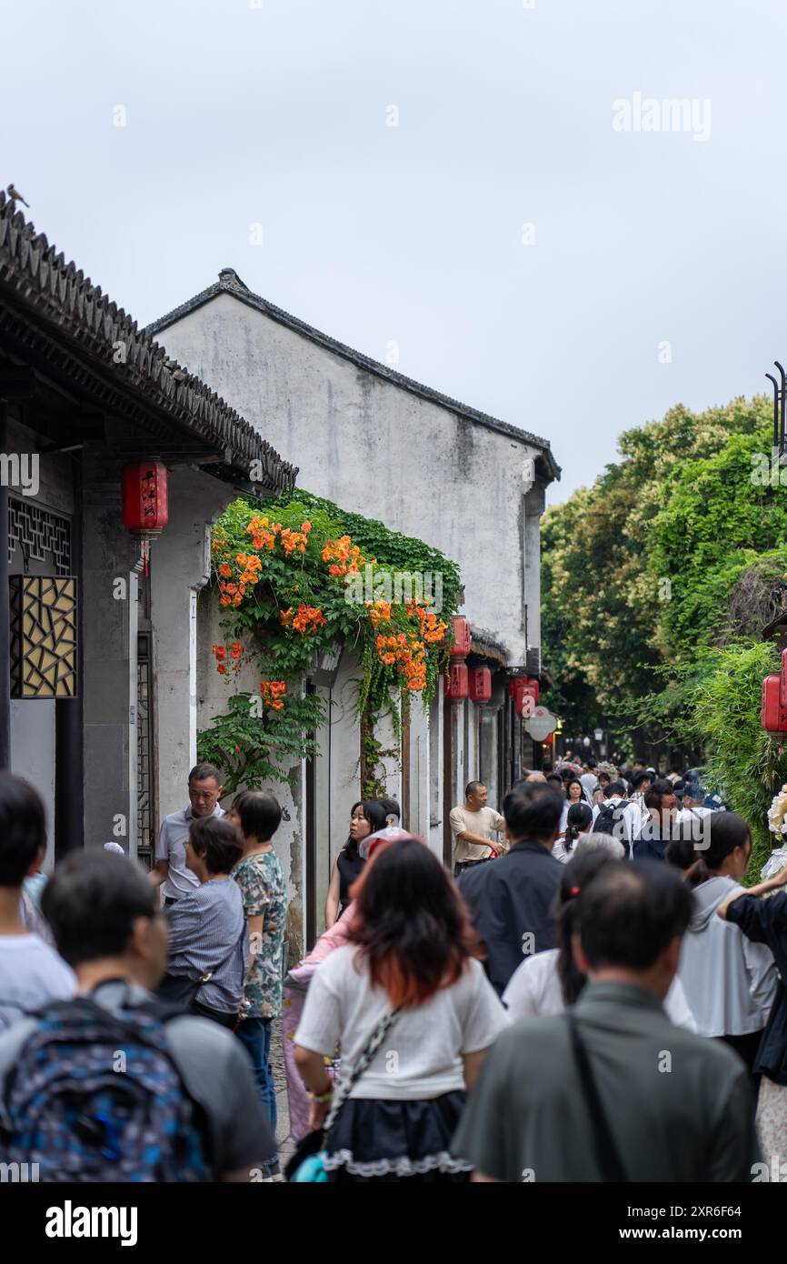 Suzhou, China - June 11, 2024 : A bustling street lined with ...