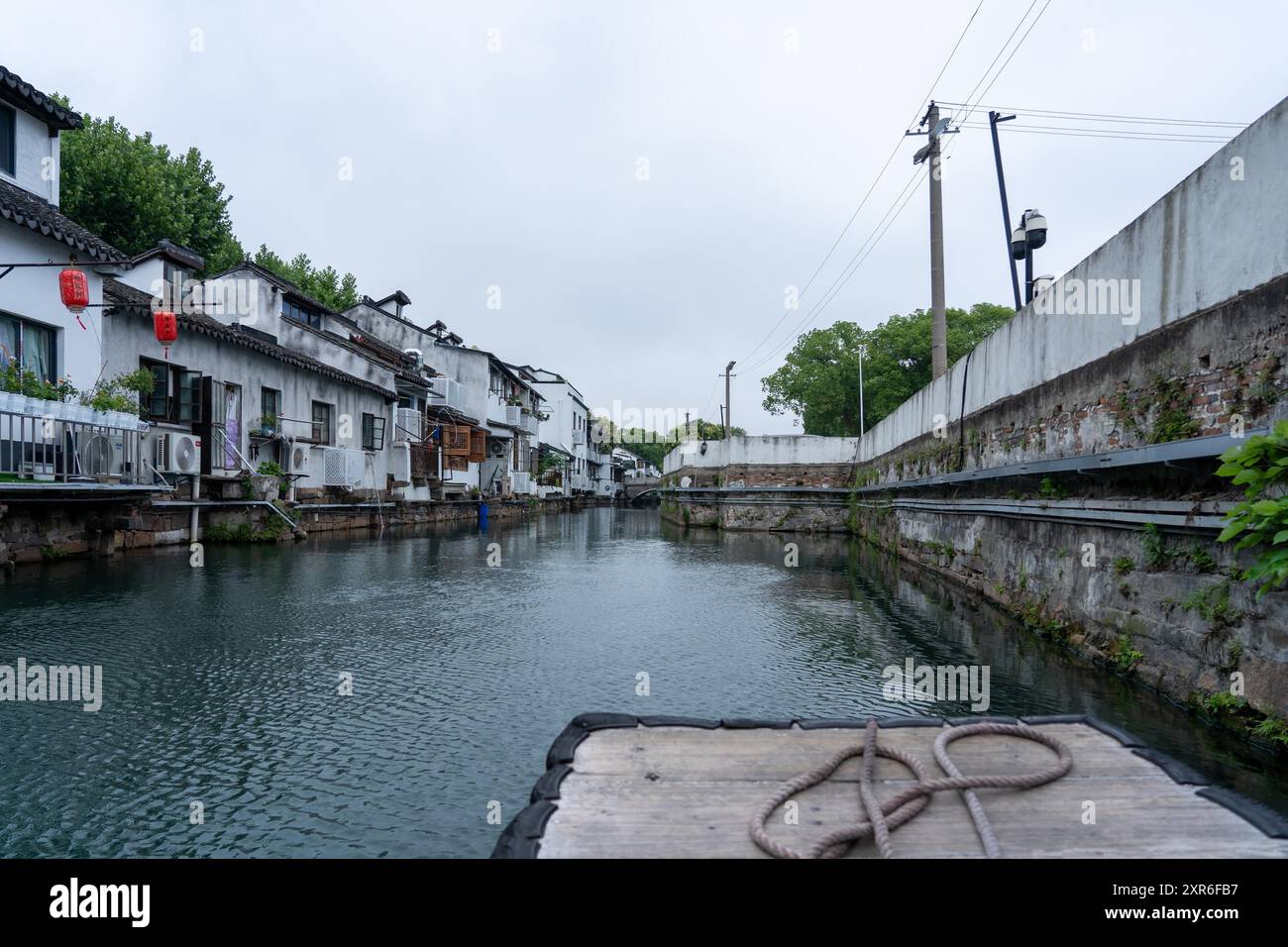 Suzhou, China - June 11, 2024 : A view down a narrow canal in a Chinese ...