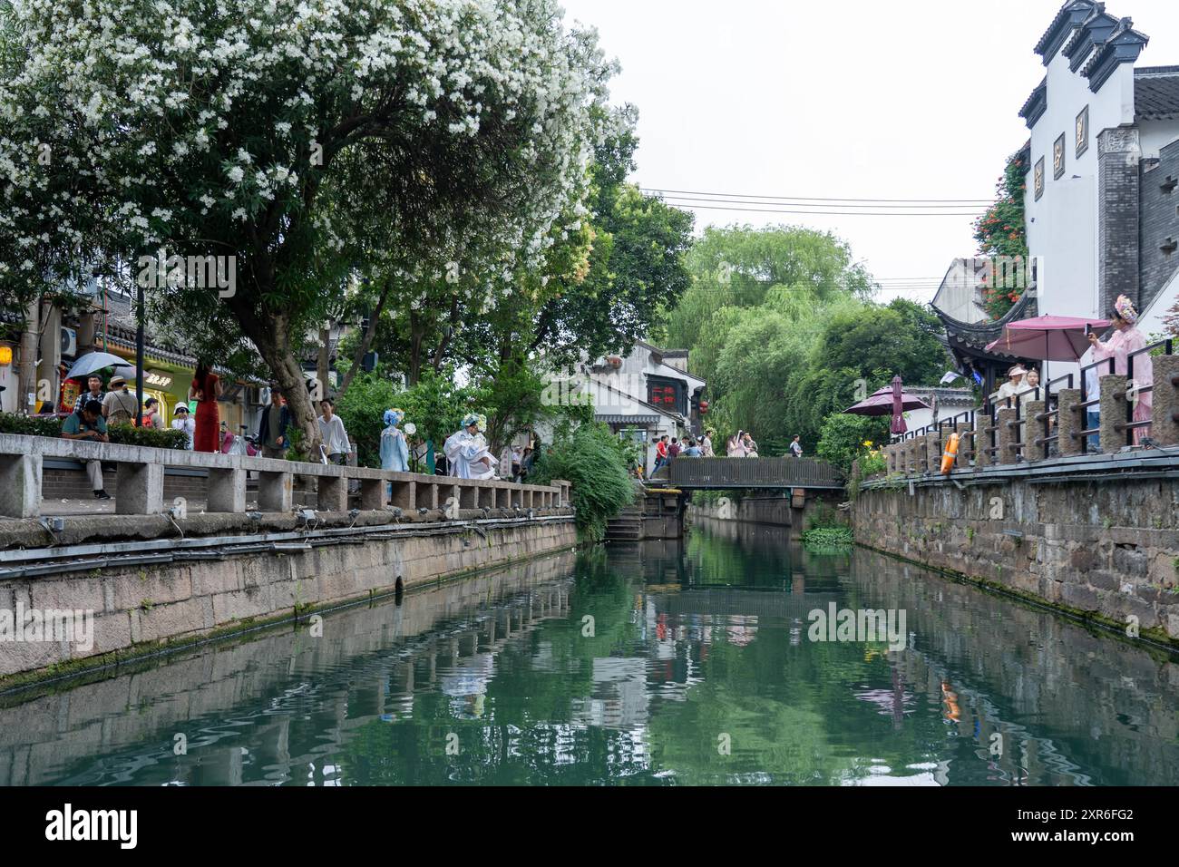 Suzhou, China - June 11, 2024 : A narrow canal flows through a ...